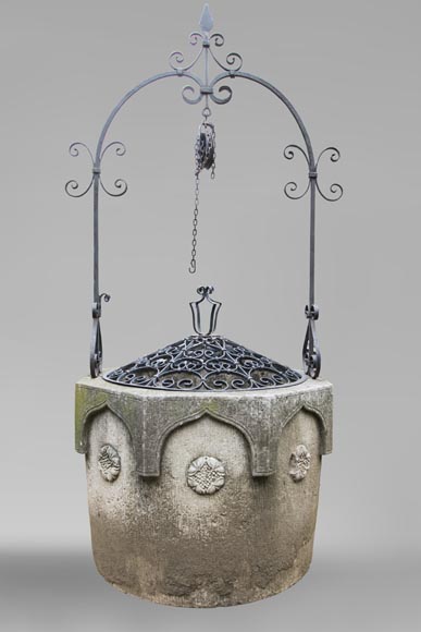 Stone well, with its base, its cover and its wrought iron frame ...