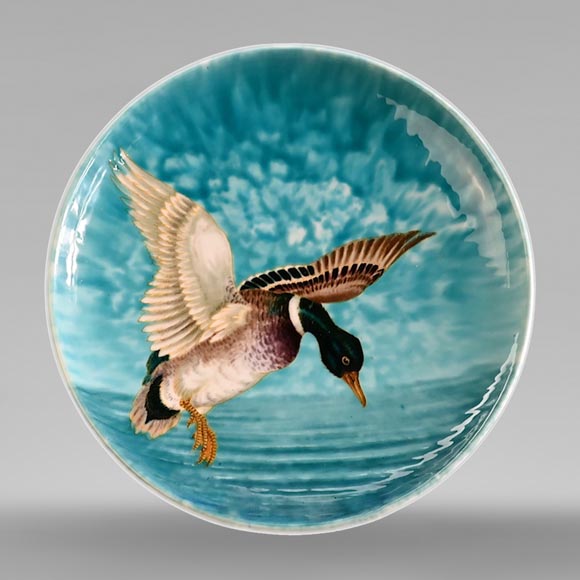 Théodore DECK (1823-1891), Earthenware dish with a flying mallard ...