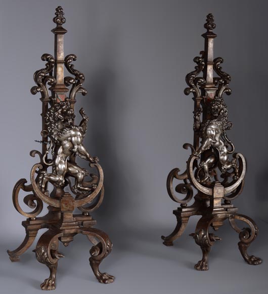 Pair of silvered iron and cat iron andirons with standing lions ...