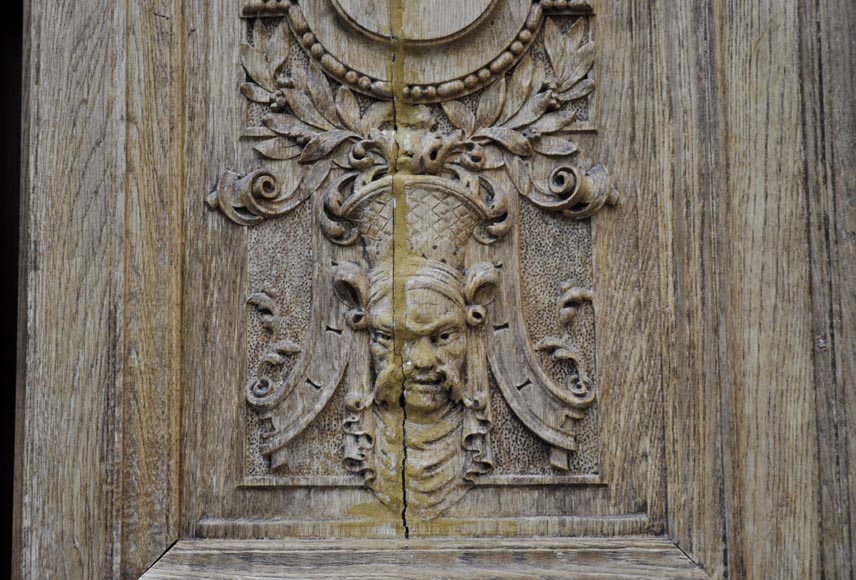 Carved oak wood double door with grotesque decor - Doors