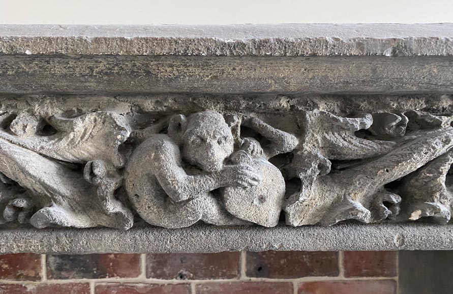 Gothic period stone mantelpiece with monsters and carved capitals - Stone