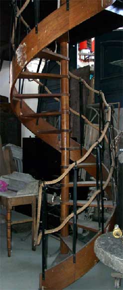 Wood spiral staircase with rope handrail. - Stairs and banisters